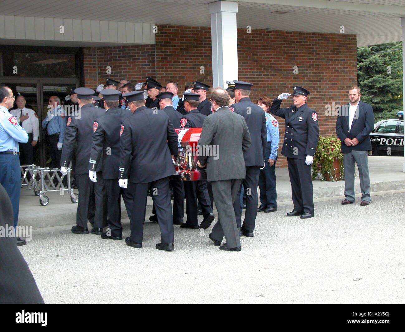 Local fire fighters and policemen attend funeral of fire chief Stock ...