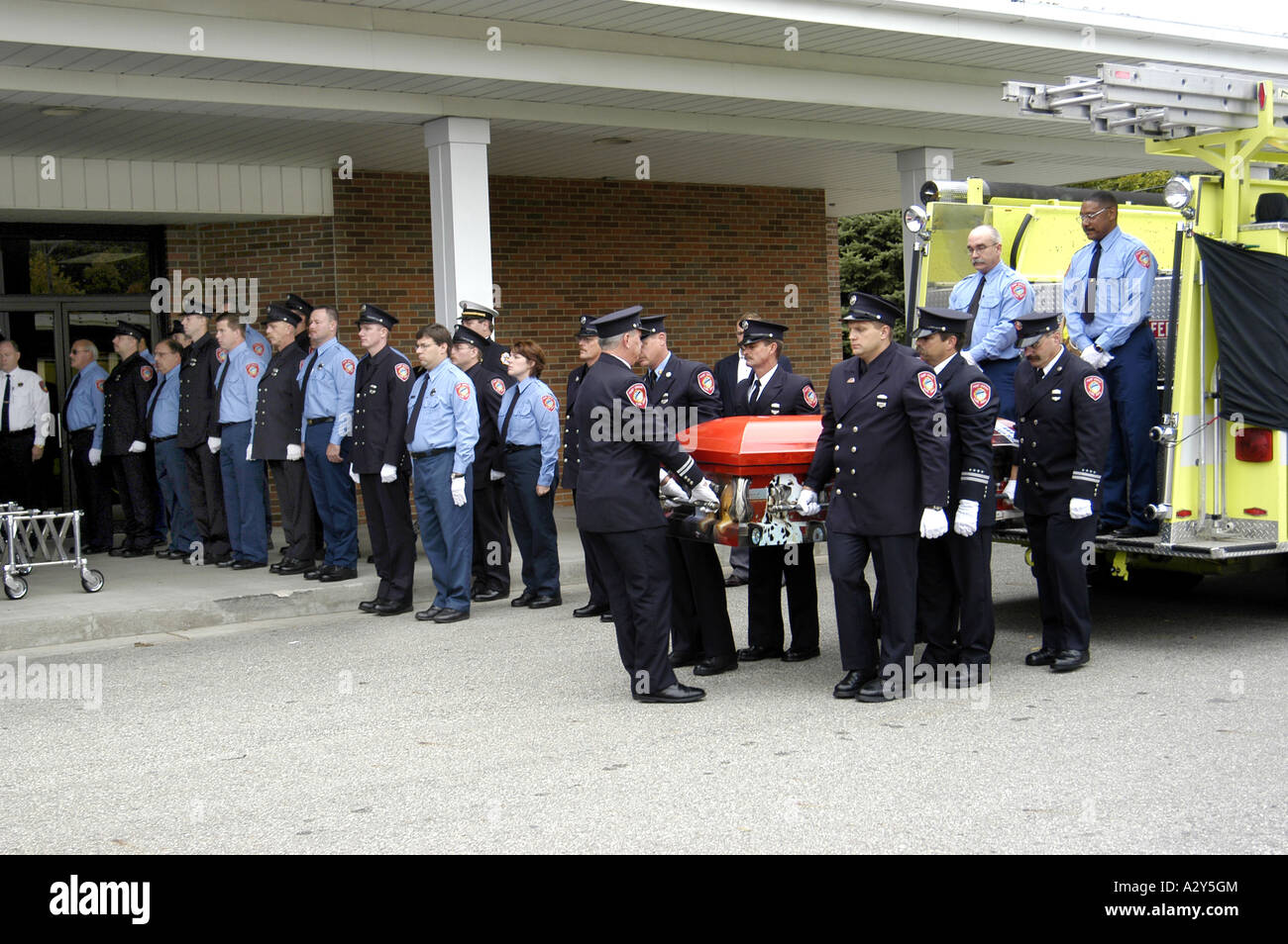 Local fire fighters and policemen attend funeral of fire chief Stock ...