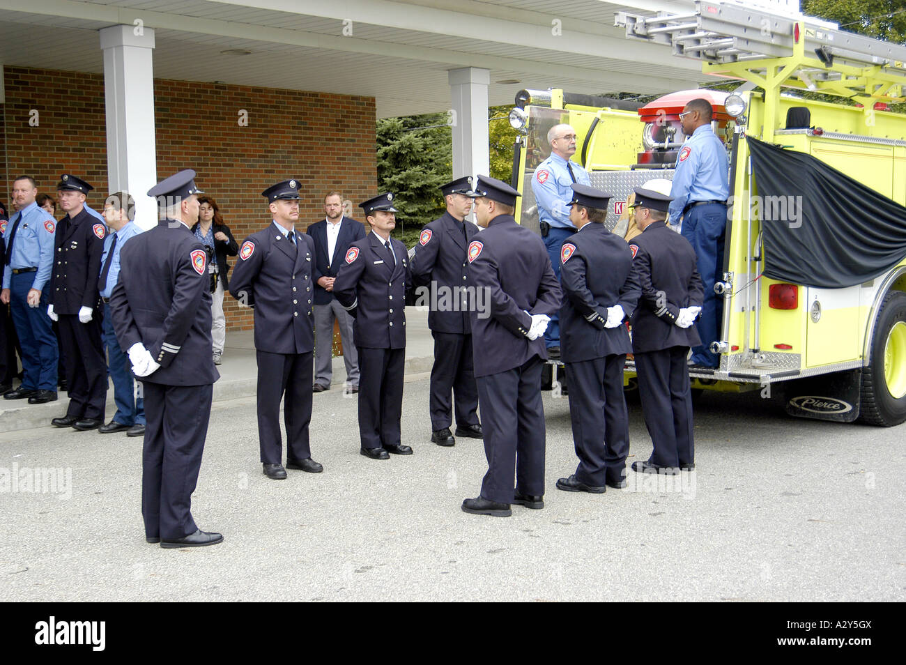 Local fire fighters and policemen attend funeral of fire chief Stock ...