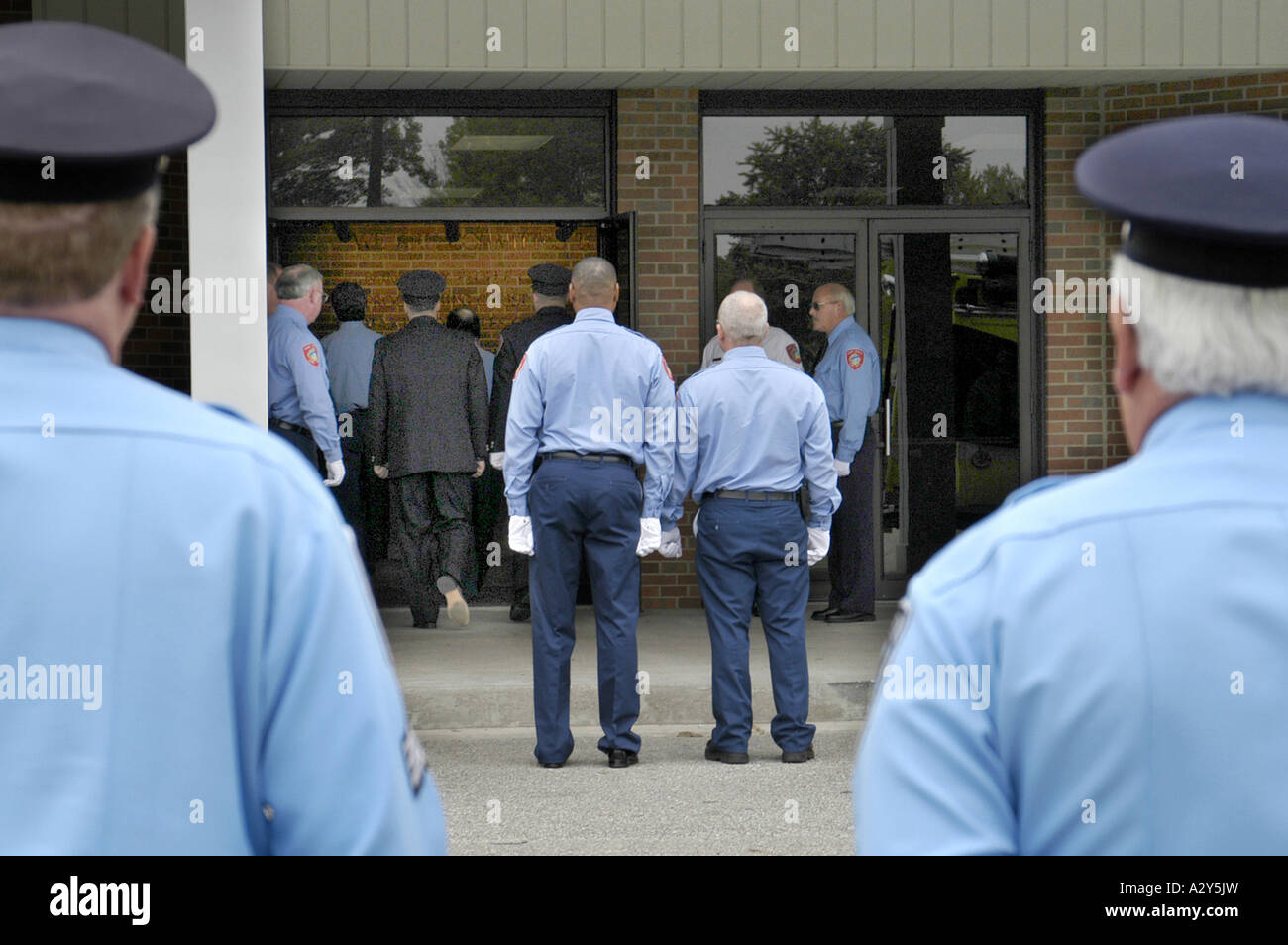 Local fire fighters and policemen attend funeral of fire chief Stock ...