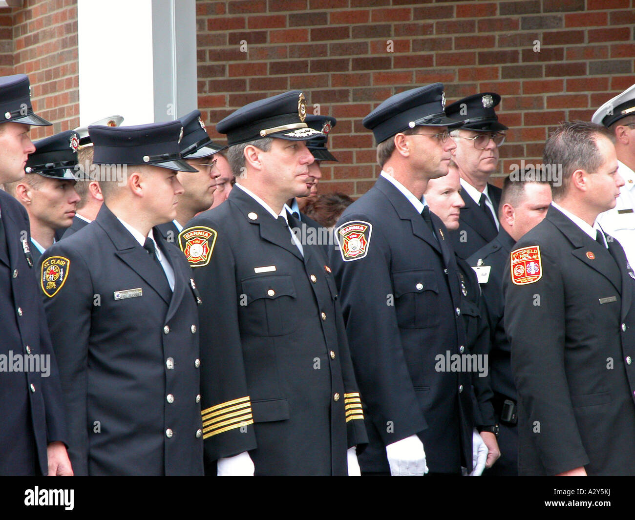 Local fire fighters and policemen attend funeral of fire chief Stock ...