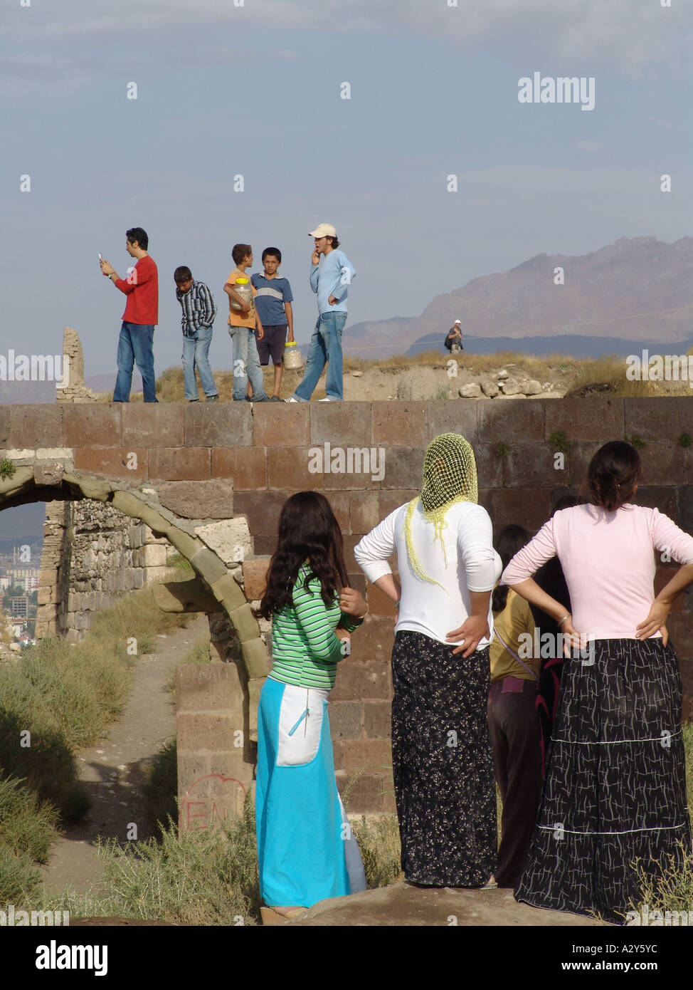 Women and men, castle, Van, Turkey August 2005 Stock Photo - Alamy