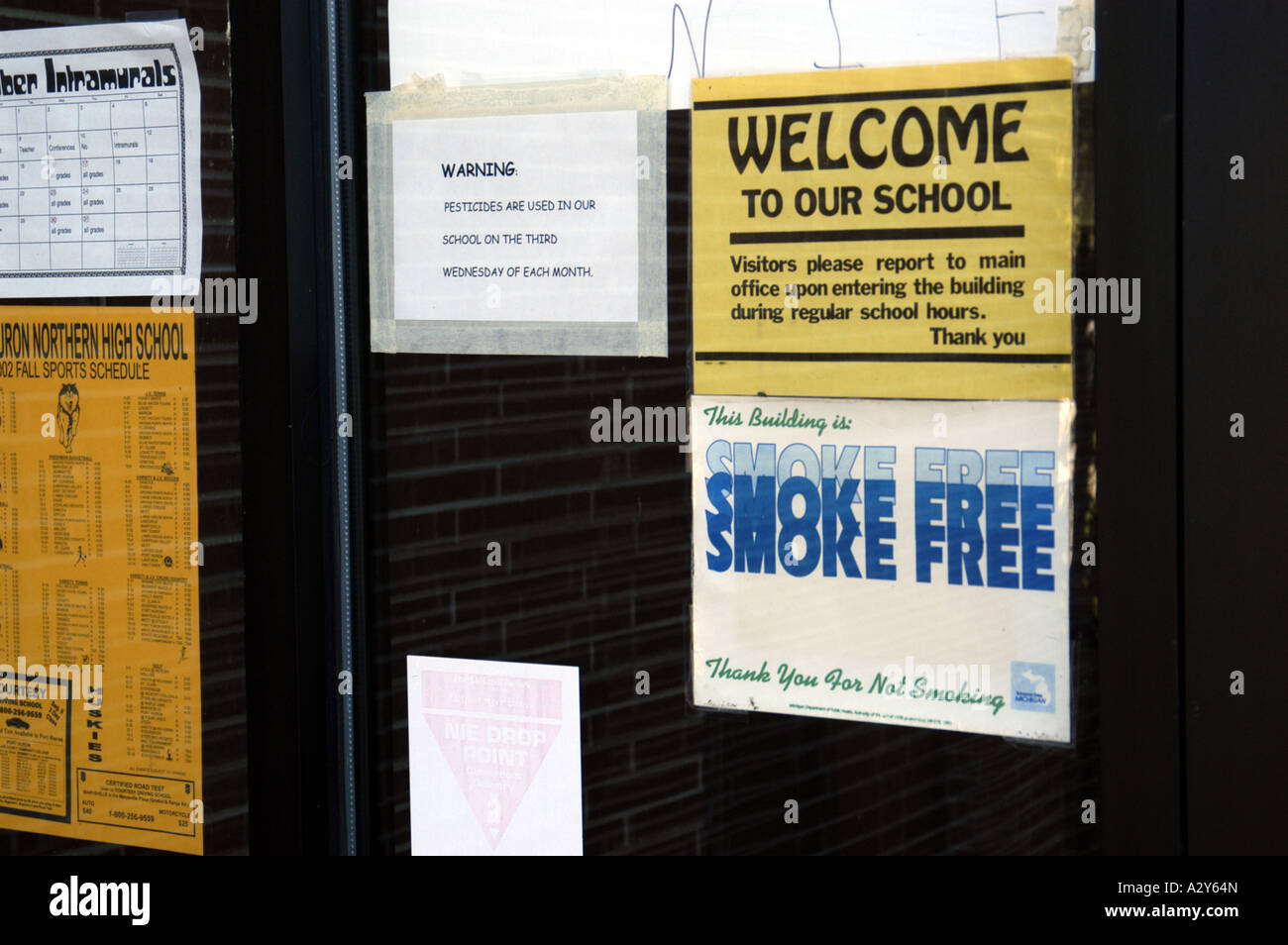 Sign on a school door stating that this is a smoke free public building ...