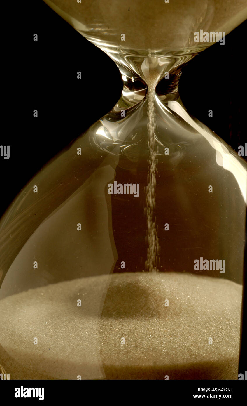 Color image of sand falling in an hourglass Stock Photo - Alamy