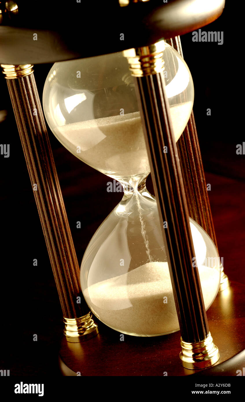 Color image of sand falling in an hourglass Stock Photo - Alamy