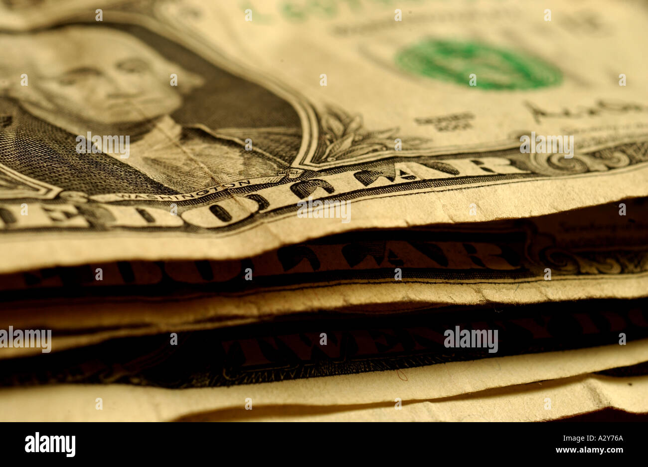 Color image of a stack of 1 one dollar US bills on a red background ...