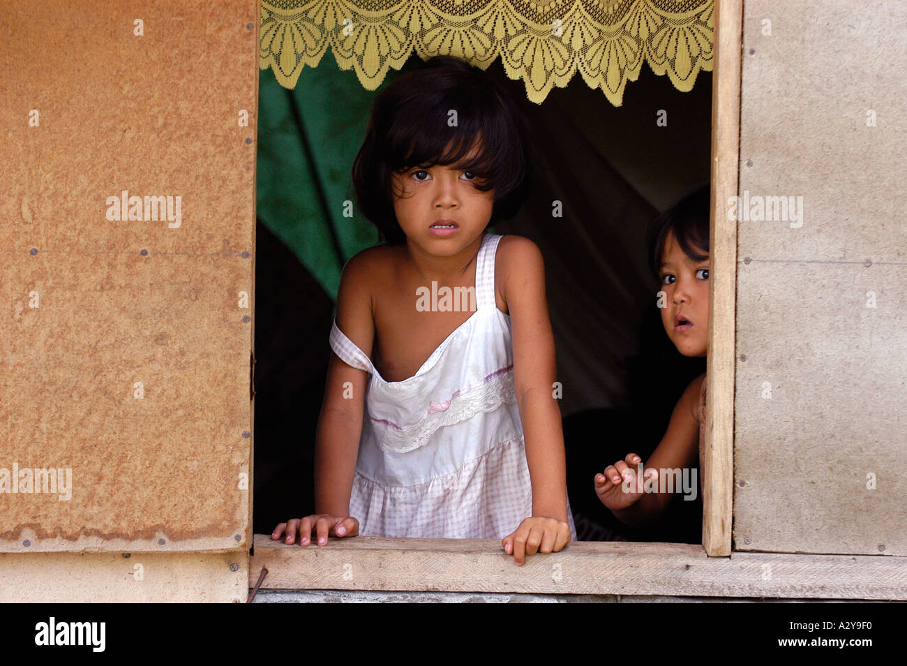 Children in window Philippines Stock Photo - Alamy
