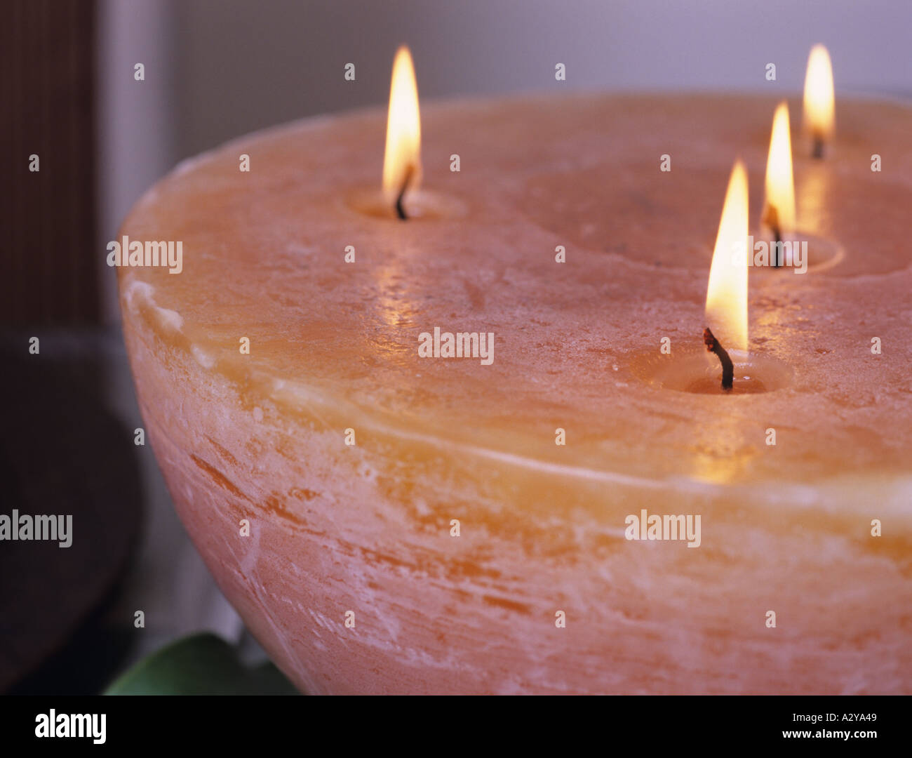 orange multi flame candle on a dining table shot in 2002 with three ...