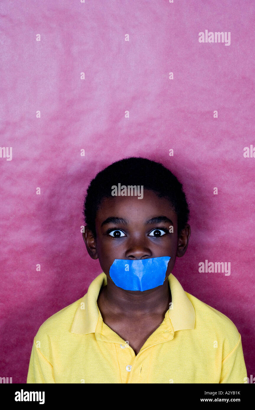 Boy with duct tape on his mouth Stock Photo - Alamy