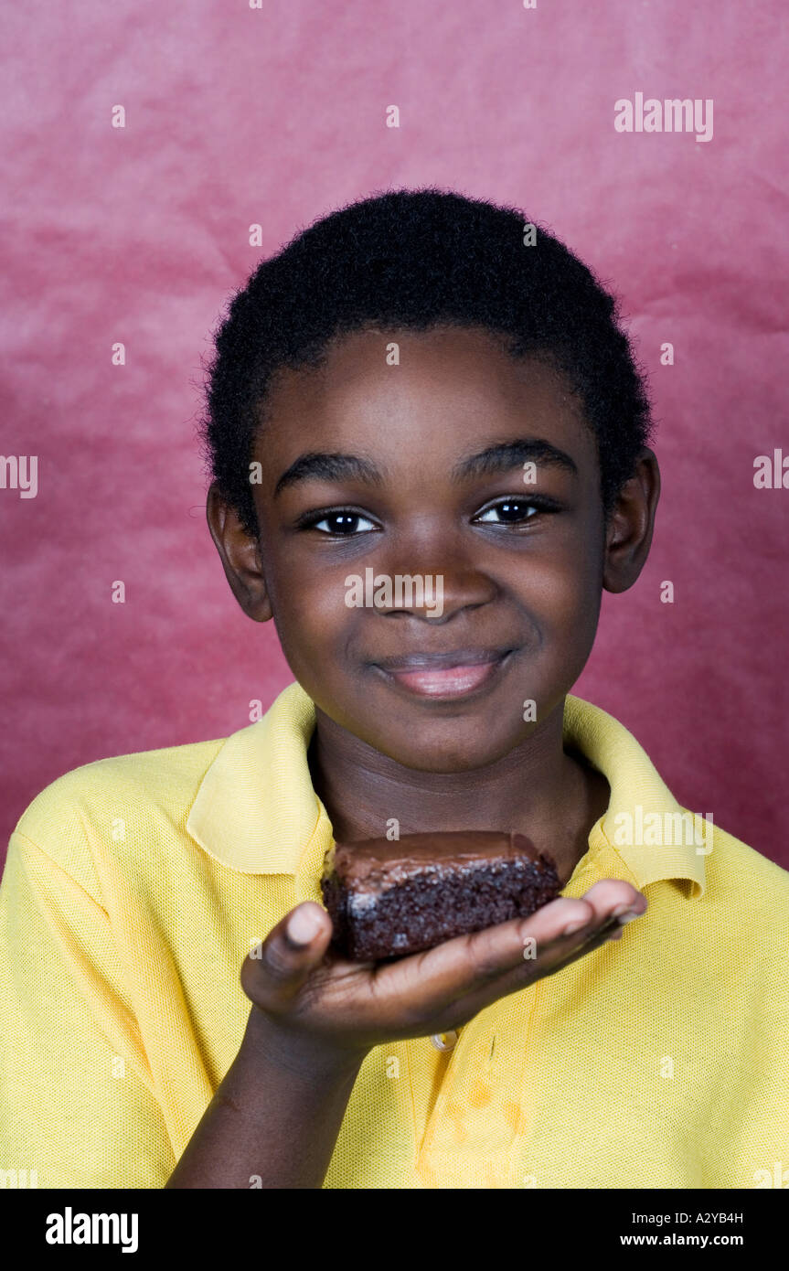 Boy holding Chocolate cake Stock Photo - Alamy