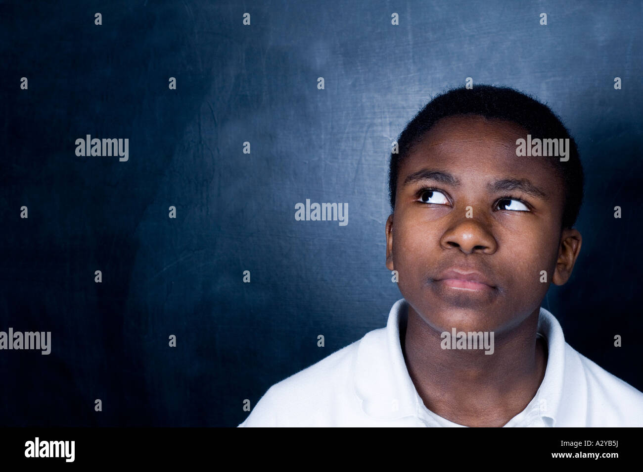 African boy thinking uniform hi-res stock photography and images - Alamy