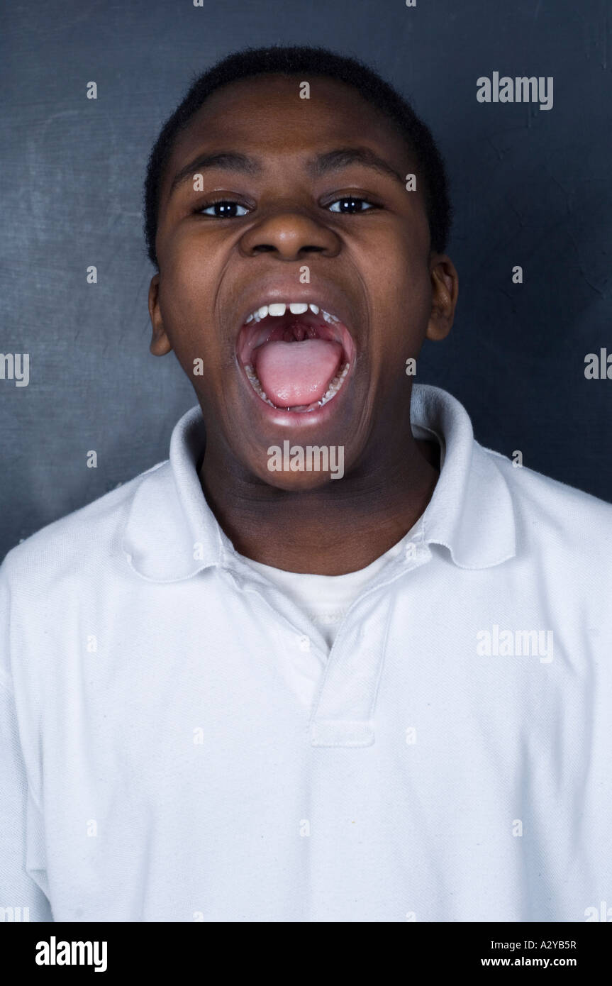 Young African American boy shouting out loud Stock Photo - Alamy