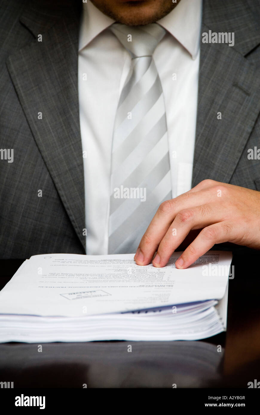 Close up of a businessman reviewing report Stock Photo - Alamy