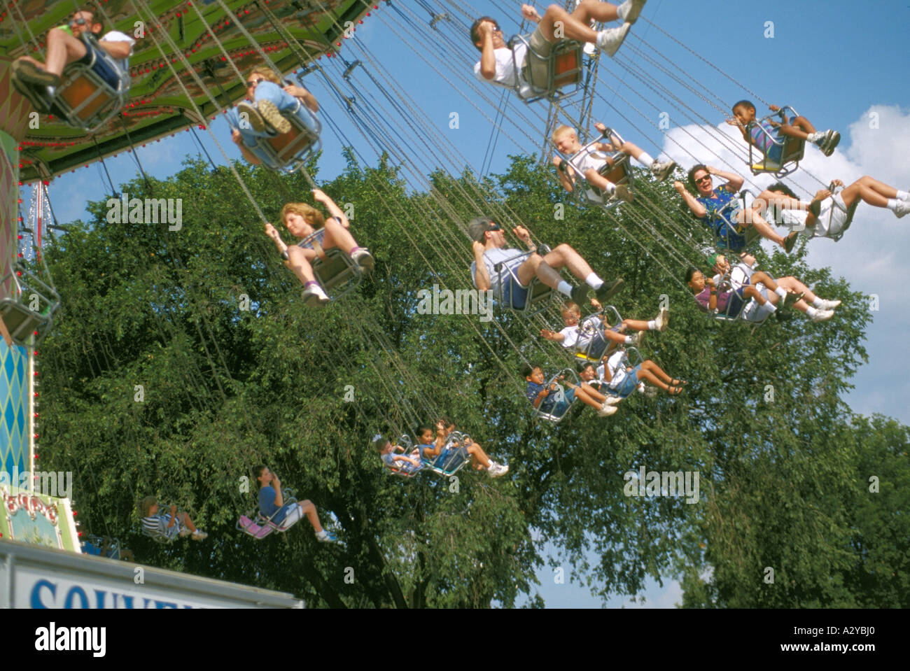 Minnesota State Fair elevated ride loaded with kids and family. St Paul ...
