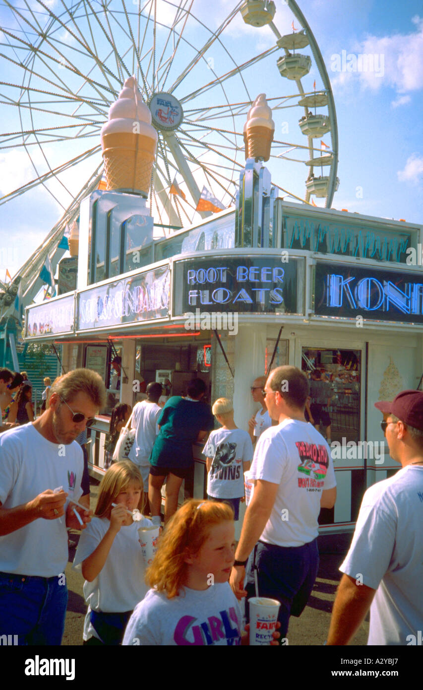 Dad age 30 and daughters age 9 and 6 eating root beer floats at ...