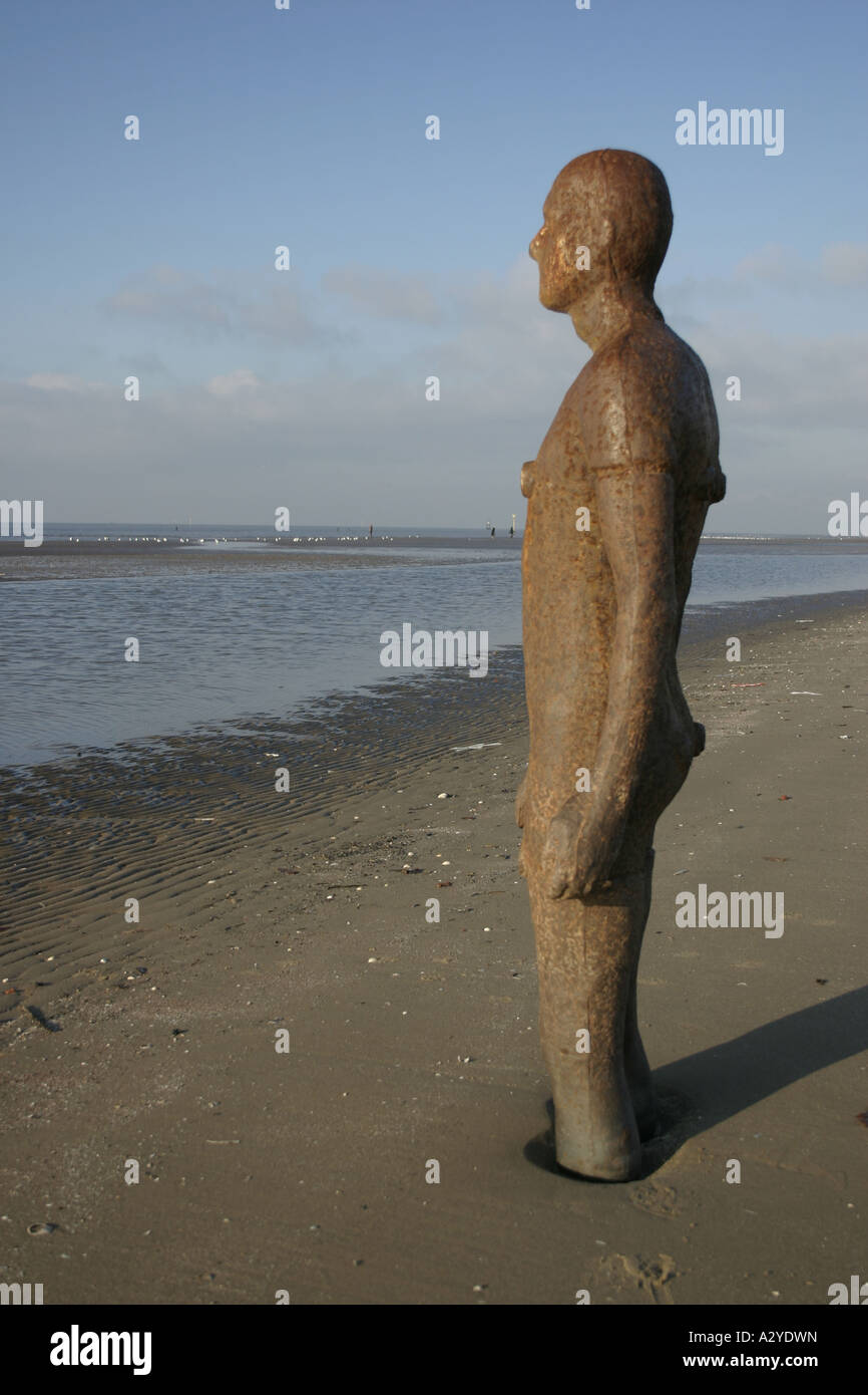 Anthony Gormley's Iron Men at Crosby, Lancashire Stock Photo - Alamy