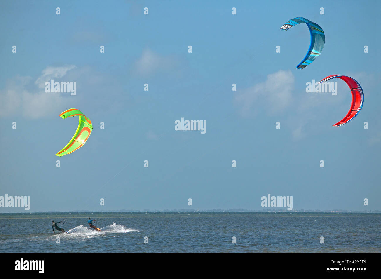 3 kiteboarders and 3 kites on Tampa bay off of Fort Desoto Park St ...