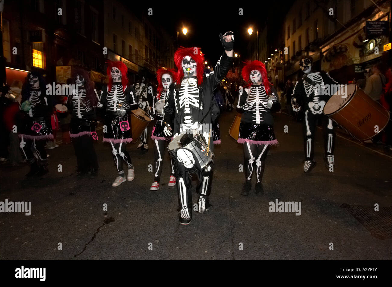 Band dressed as skeletons with red hair march down shipquay street ...