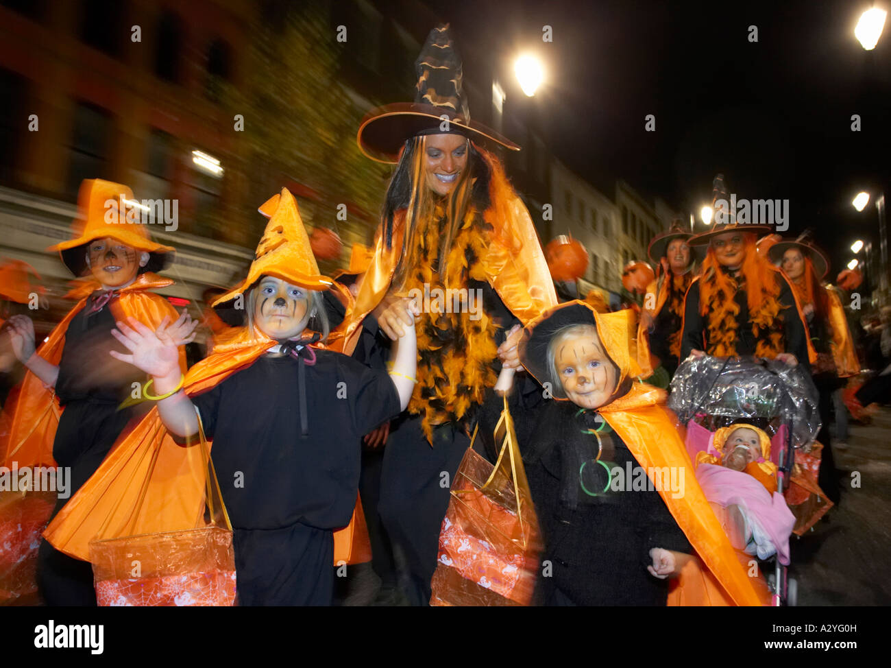 schoolchildren and teachers dressed as orange pumpkins parade down ...