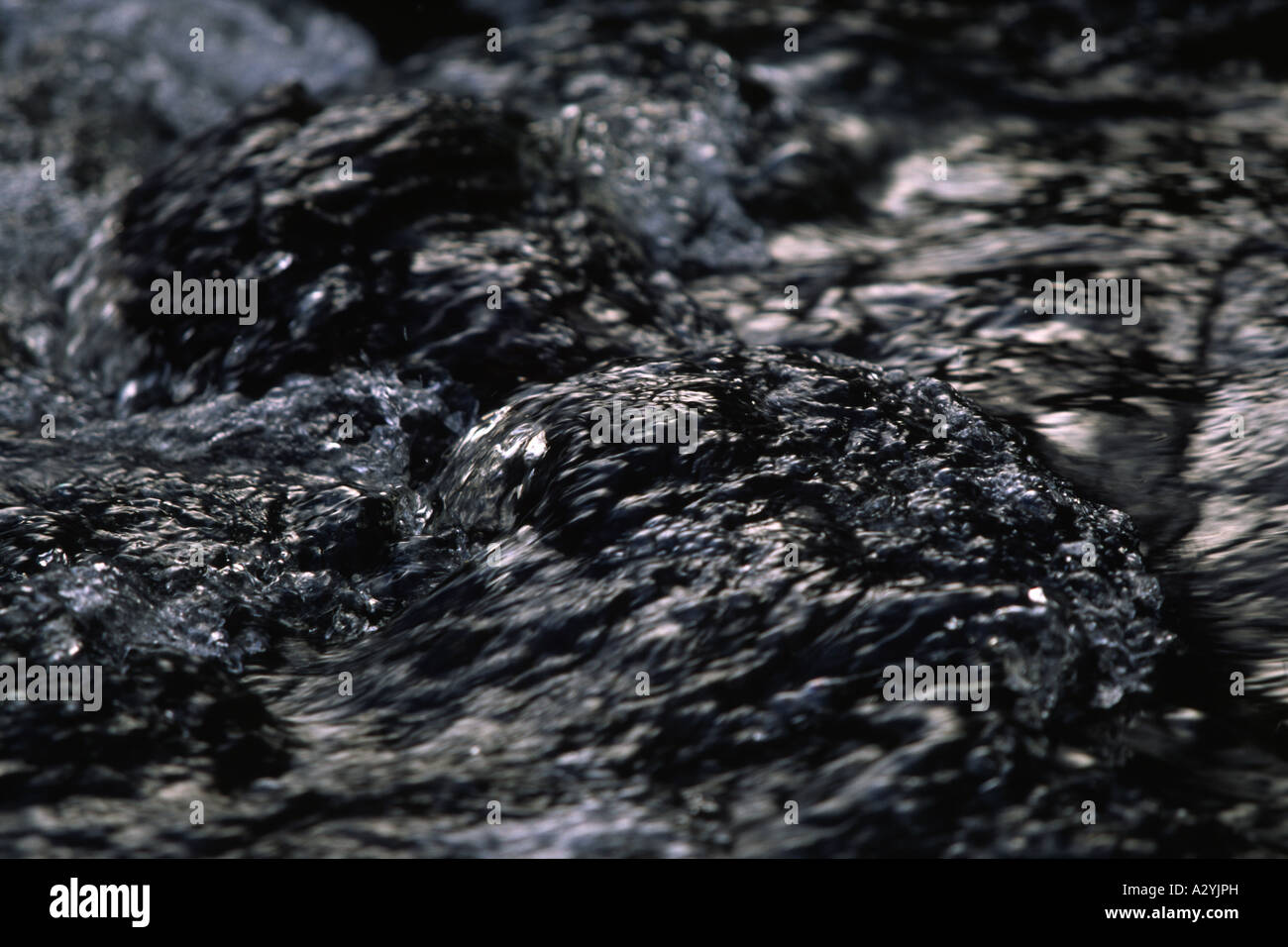 Water running down a hill stream, Powys, Wales, UK Stock Photo - Alamy