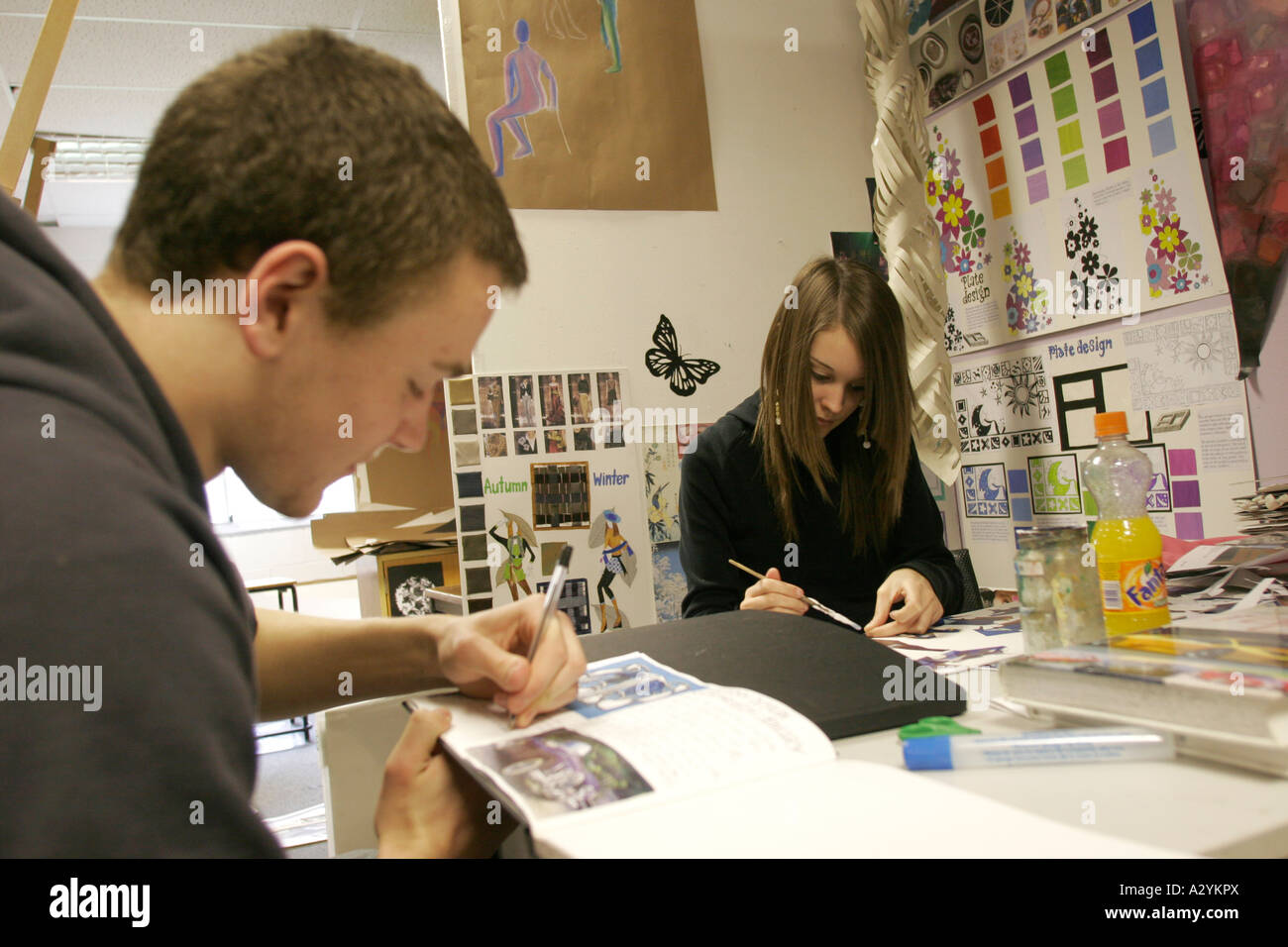 Male and Female student in art and design course sixth form college ...