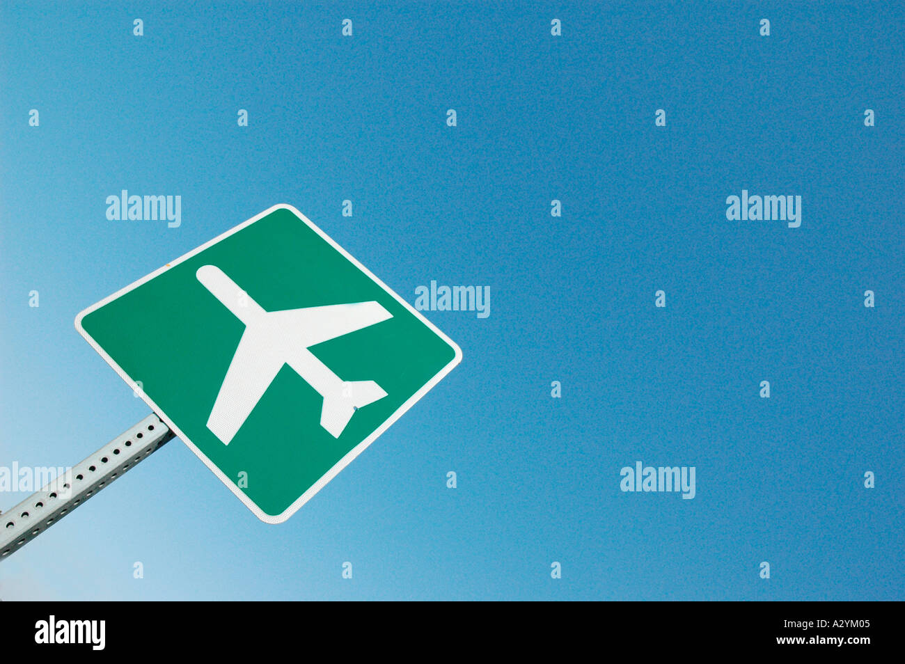 Airport sign with symbol of plane pointing at site for drivers to ...