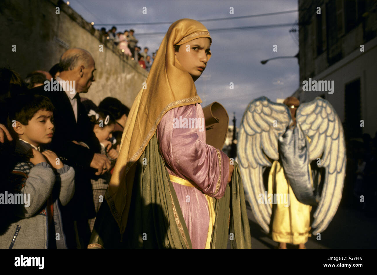 malta girl wearing headscarf robe looking annoyed during easter ...
