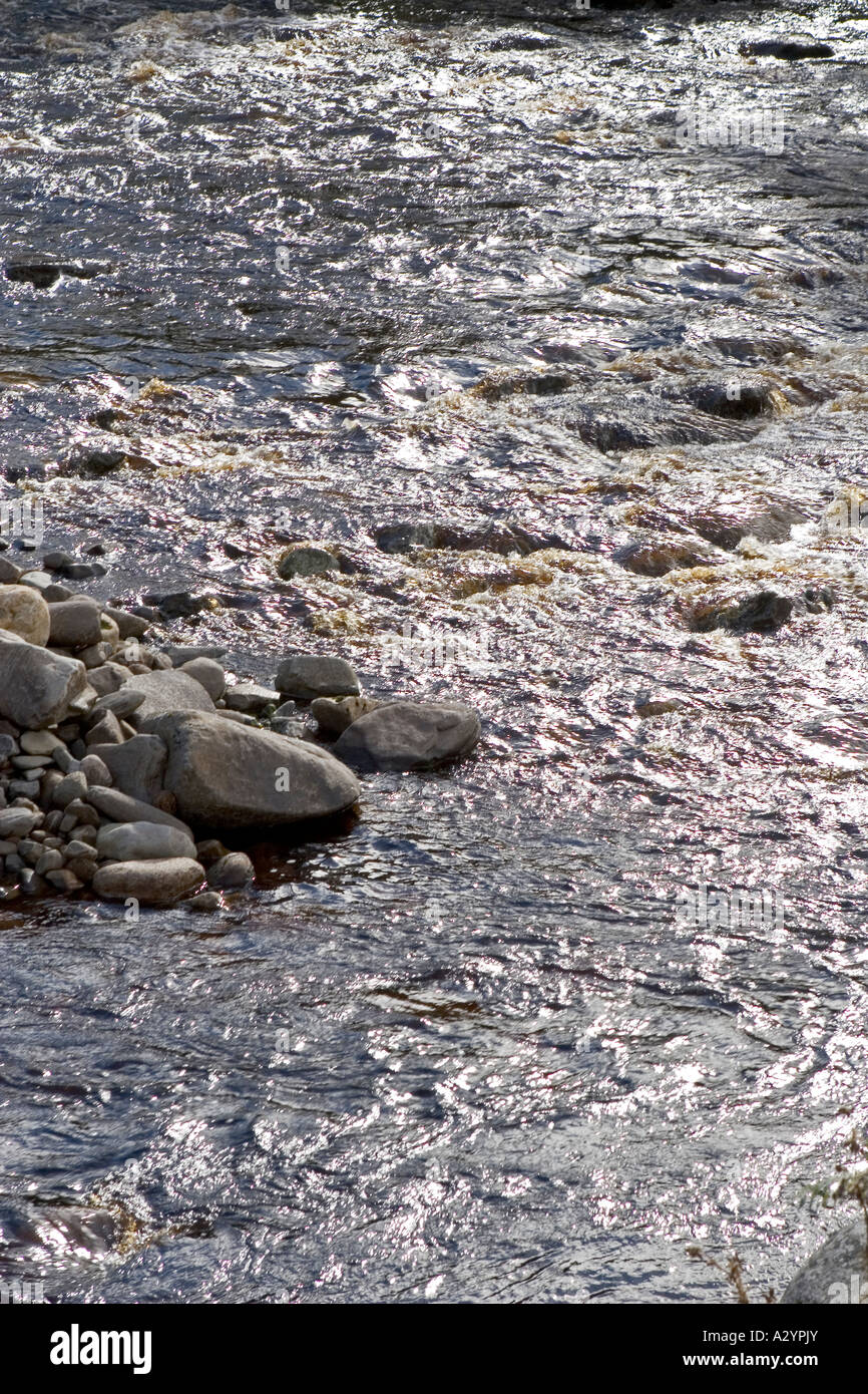 Close up of fast flowing river water and rocks in Scotland, UK Stock ...
