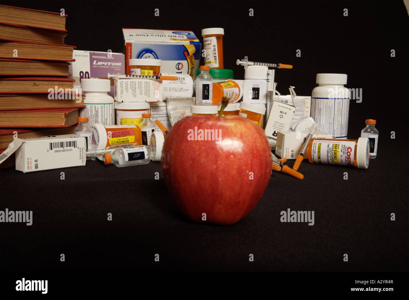 fruit apple book drug medicine Stock Photo - Alamy