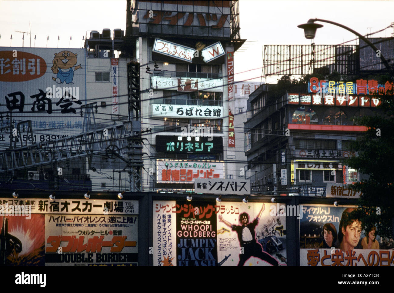 tokyo japan neon adverts for western films compete for advertising ...