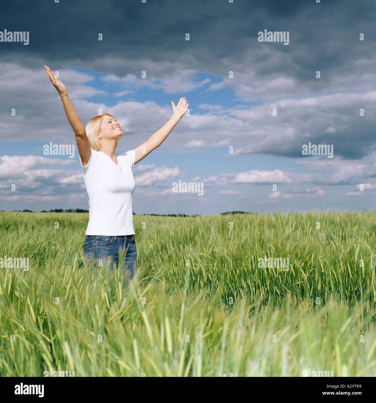 Woman arms up field hi-res stock photography and images - Alamy