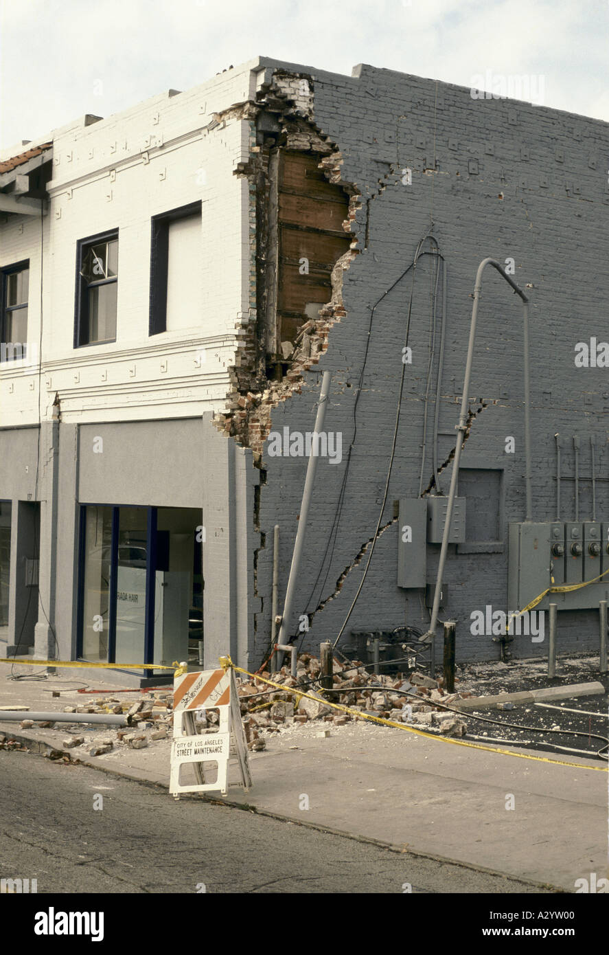 fallen bricks from damaged building with cracks in walls earthquake ...