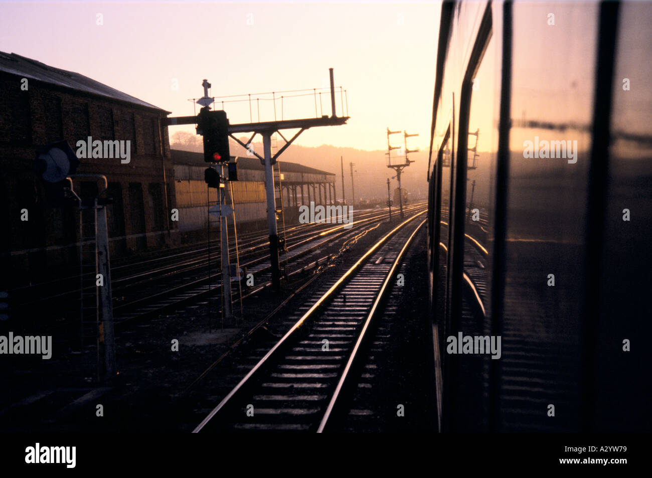 view of rail tracks as seen from the side of a train Stock Photo - Alamy