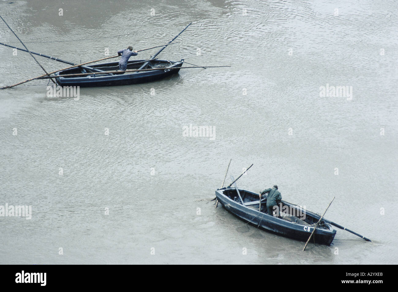 men salmon fishing in boats river wye nr chepstow 1983 Stock Photo - Alamy