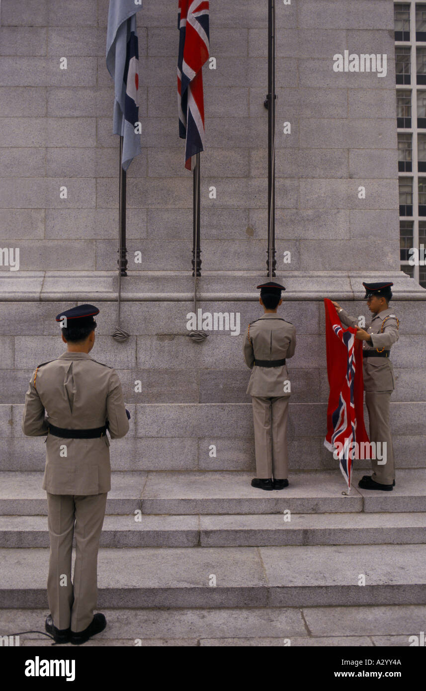 Man lowering british union jack hi-res stock photography and images - Alamy