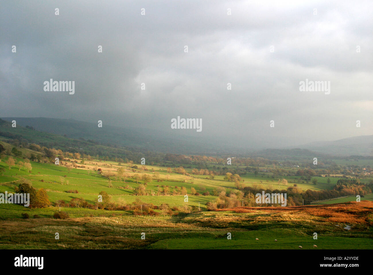 Sunlight through clouds over Castleton from Mam Tor Derbyshire Stock ...