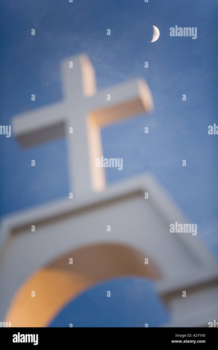 Moon over cross of church Stock Photo - Alamy