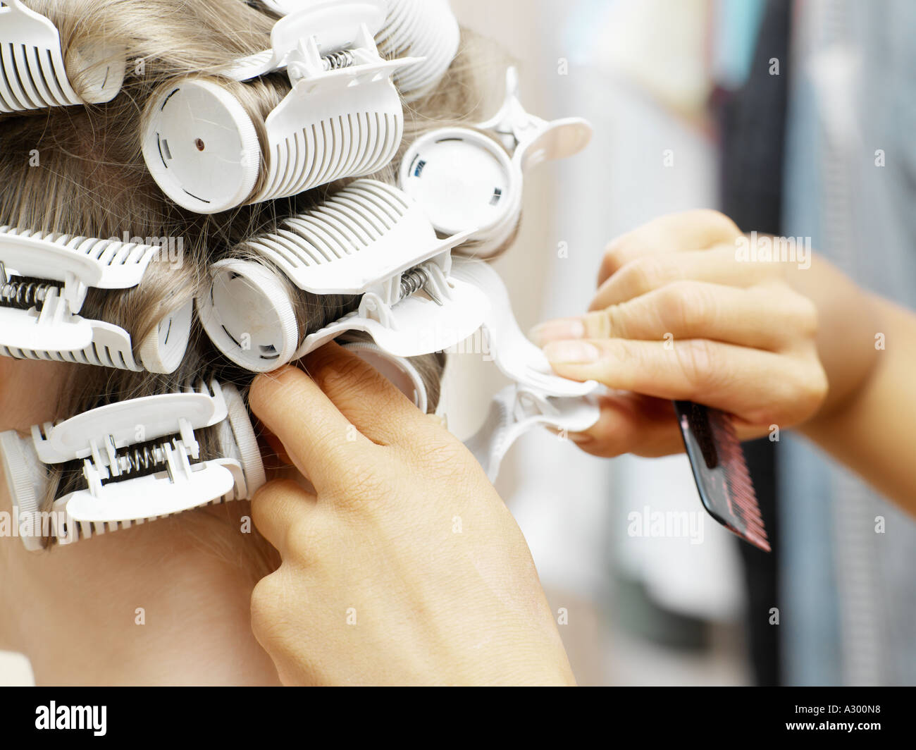 Hairdresser putting in curlers Stock Photo - Alamy