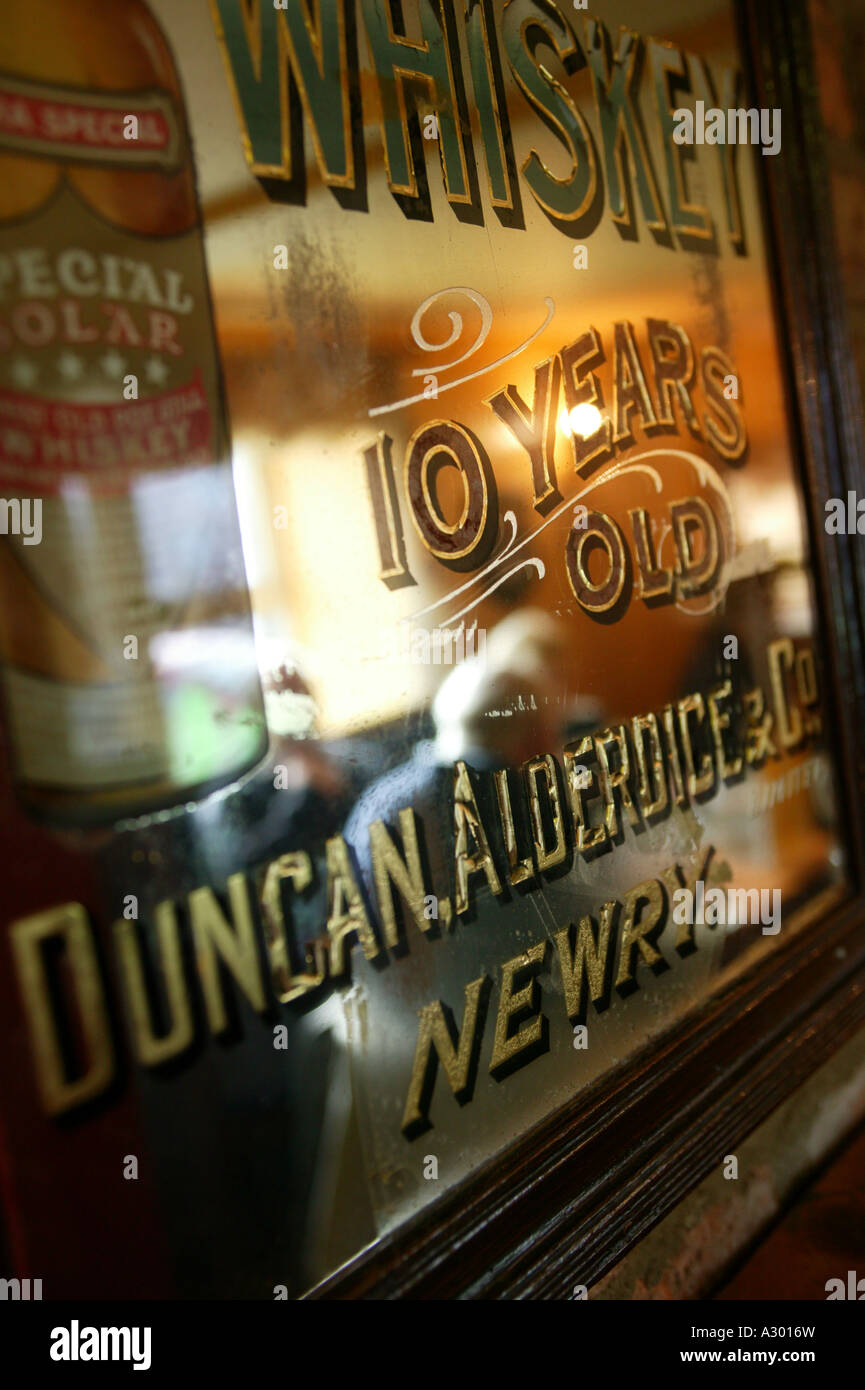 Whiskey mirror in Irish pub Stock Photo - Alamy