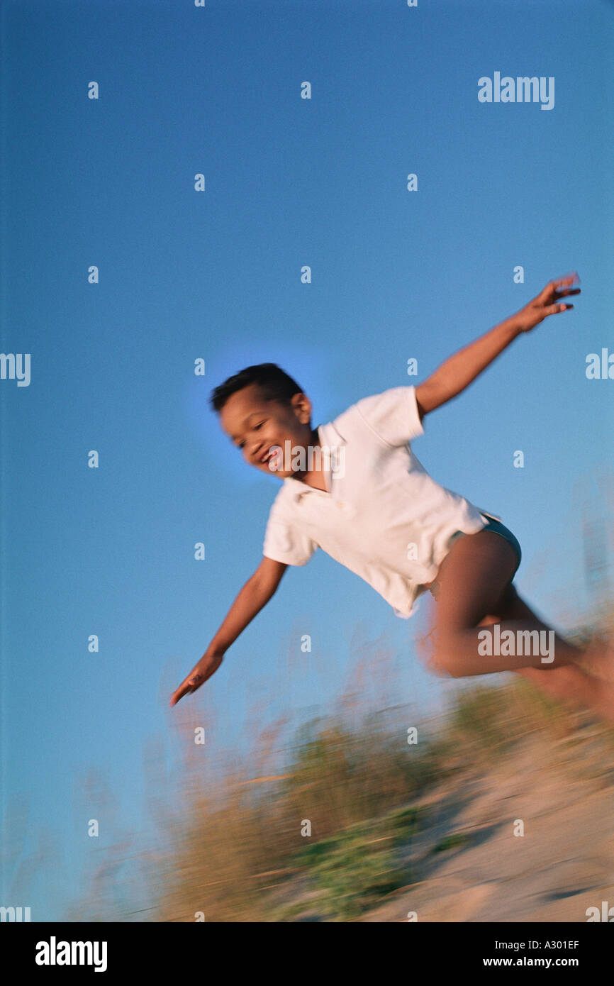 boy running with arms out Stock Photo - Alamy