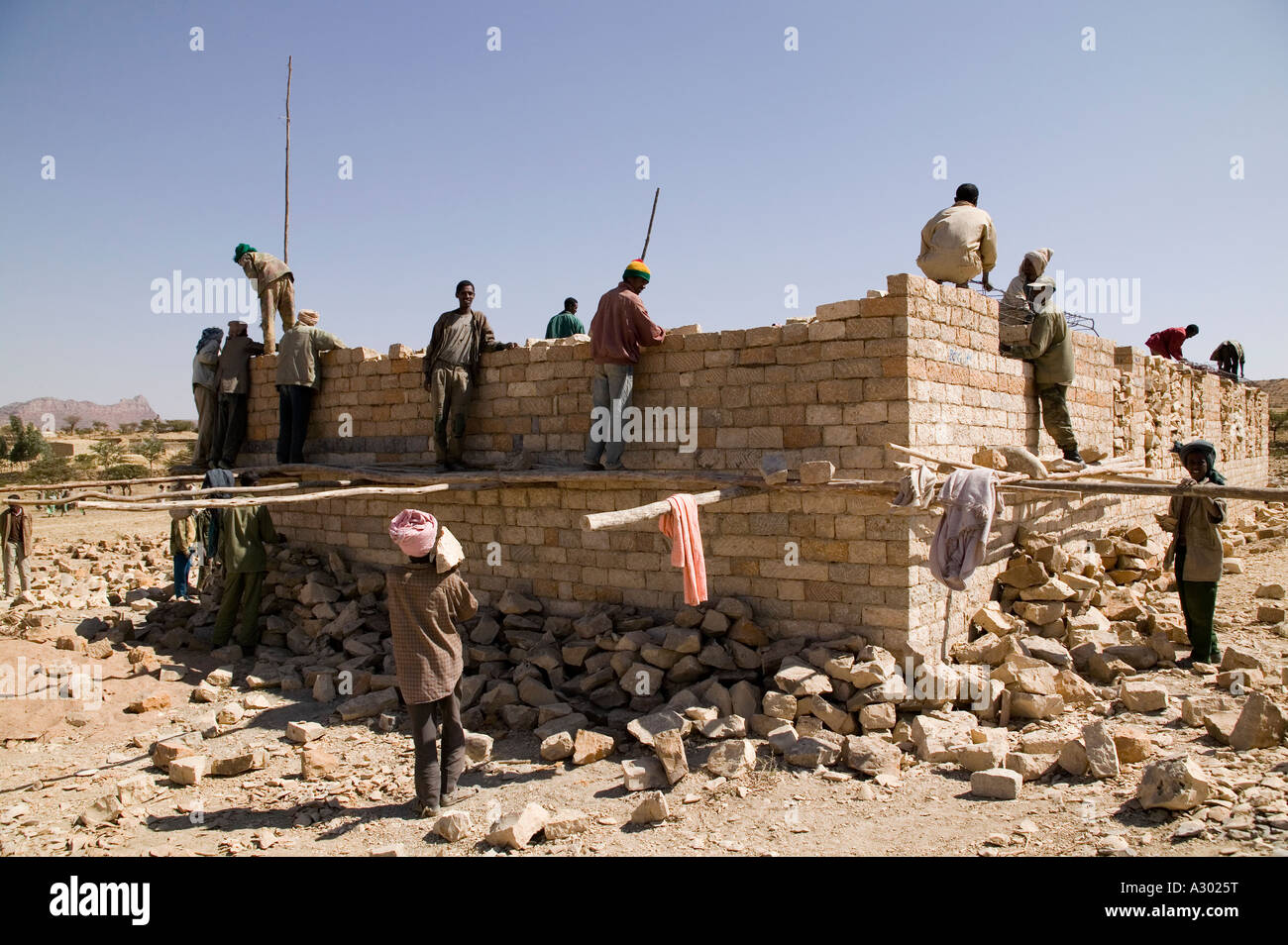 The community working together to build a new school for their children ...