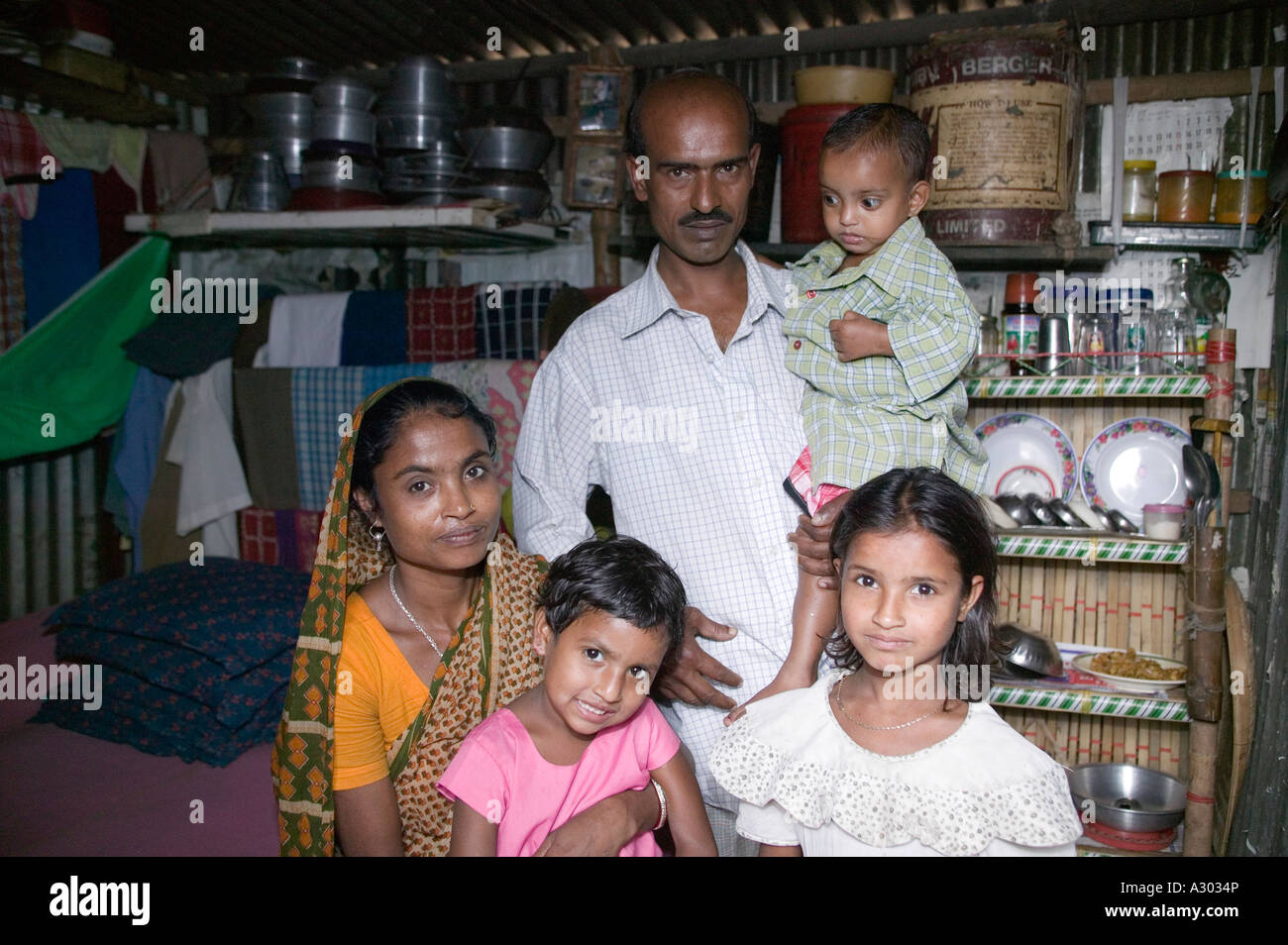 Portrait of a rickshaw puller and his family Stock Photo - Alamy