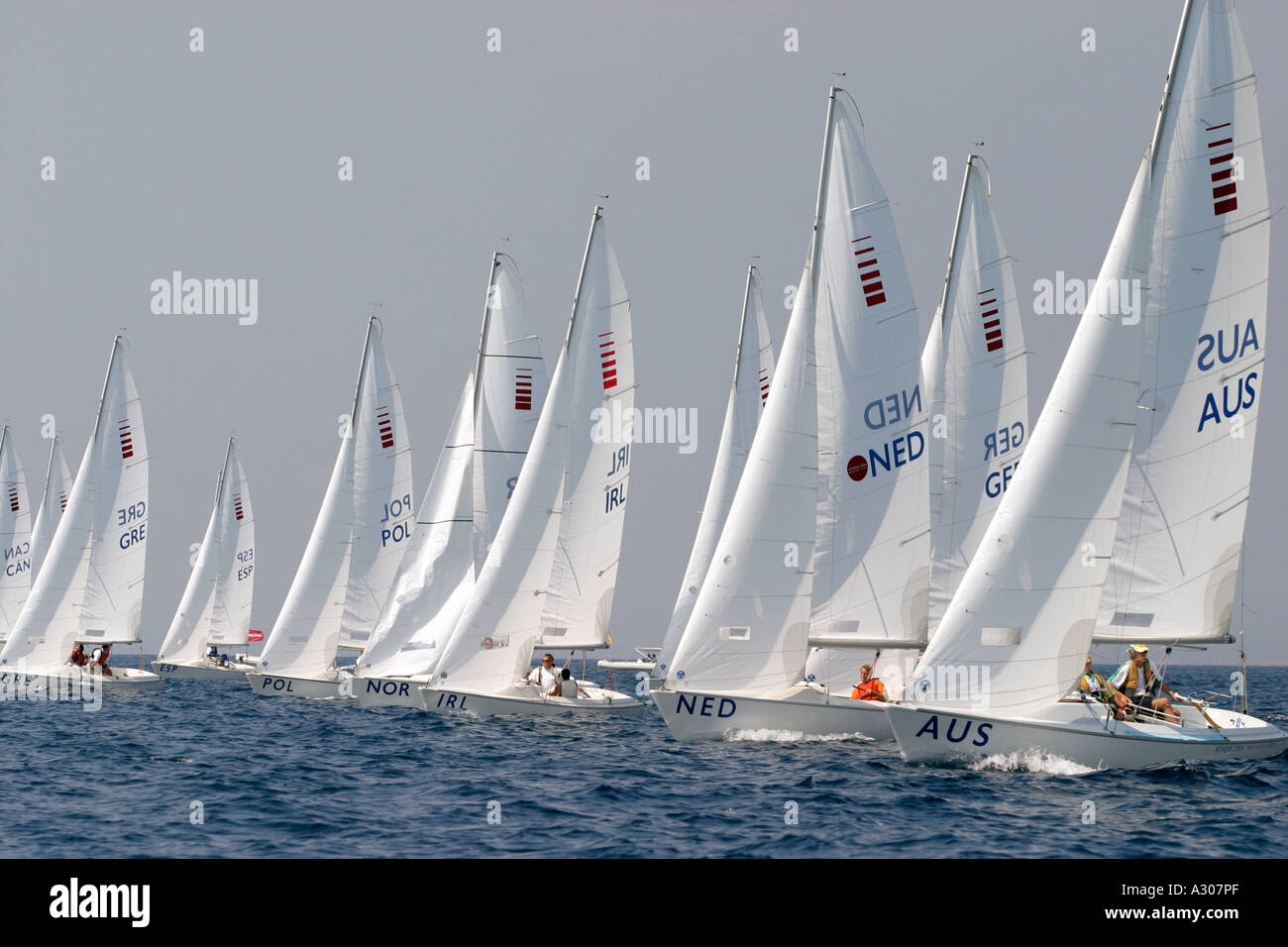 Mixed Sonar Class Sailing fleet heads for the start line during the ...