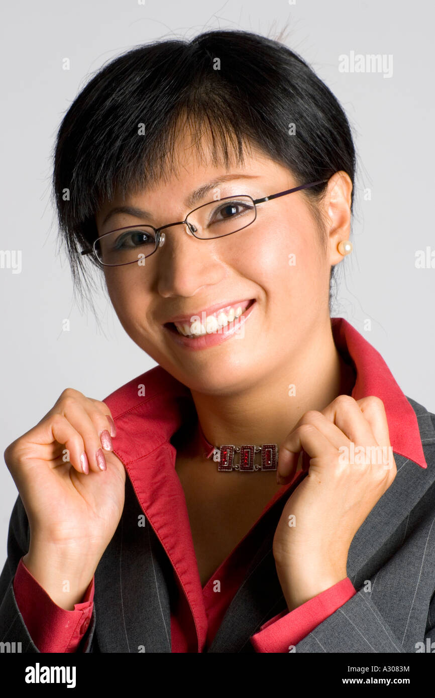 Chinese business woman in business suit and spectacles Stock Photo - Alamy