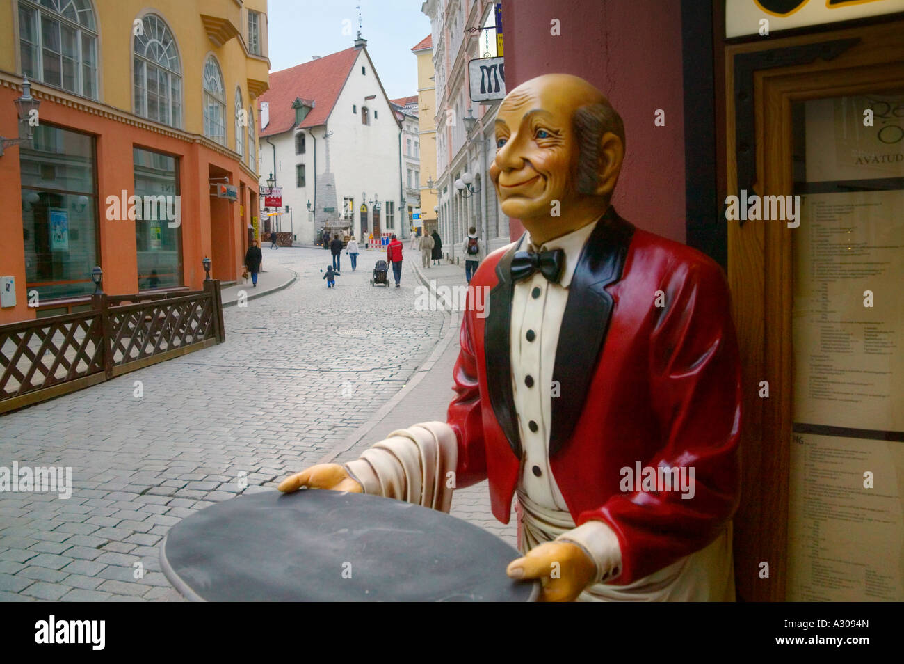 Sculpture of waiter holding tray outside a restaurant Tallinn Estonia ...