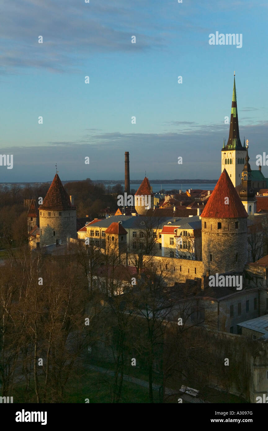 Tallinn cityscape dominated by St Olaf's Church and city wall towers ...