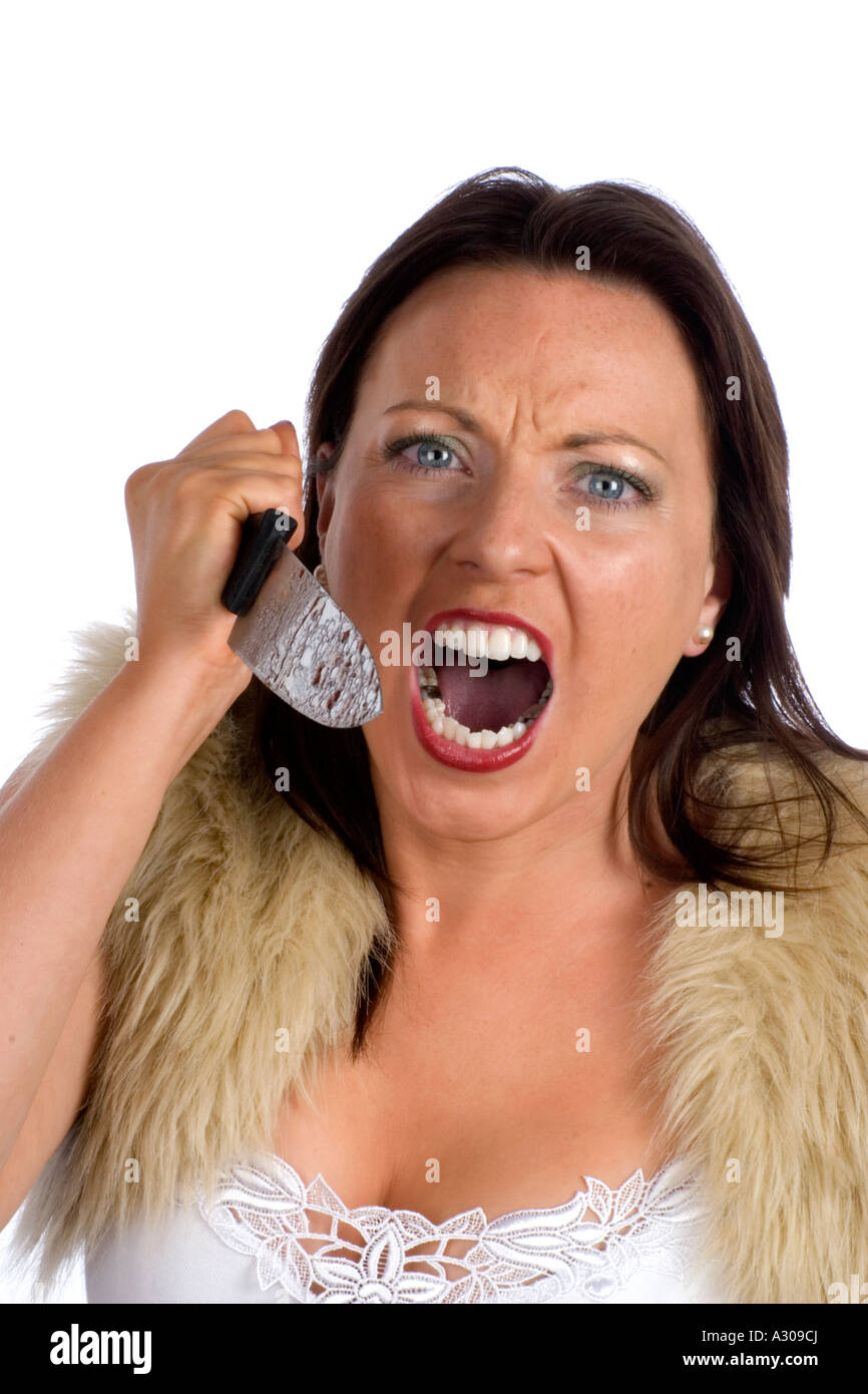 Angry woman wielding a large knife Stock Photo - Alamy