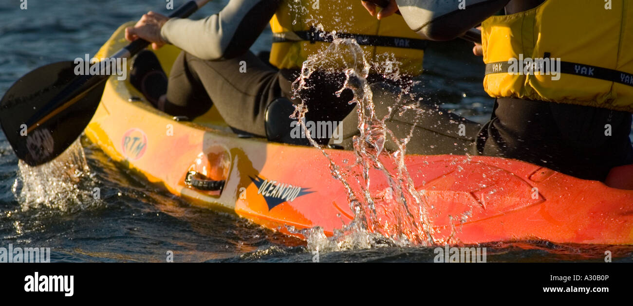 two men paddling kayak on Lake Windermere in the Lake District England ...