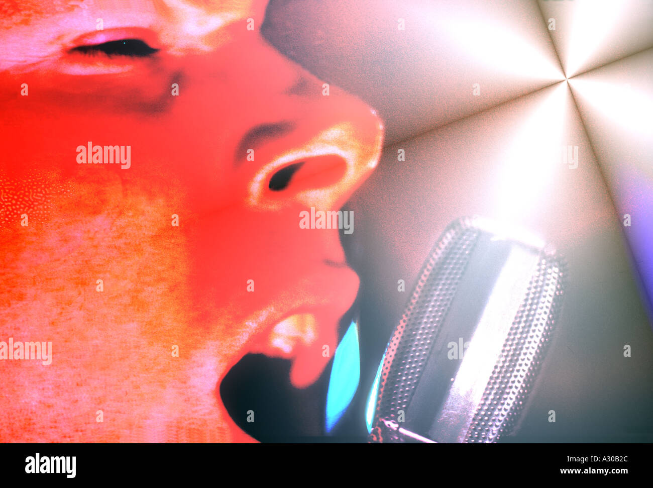 Singer with microphone Stock Photo - Alamy