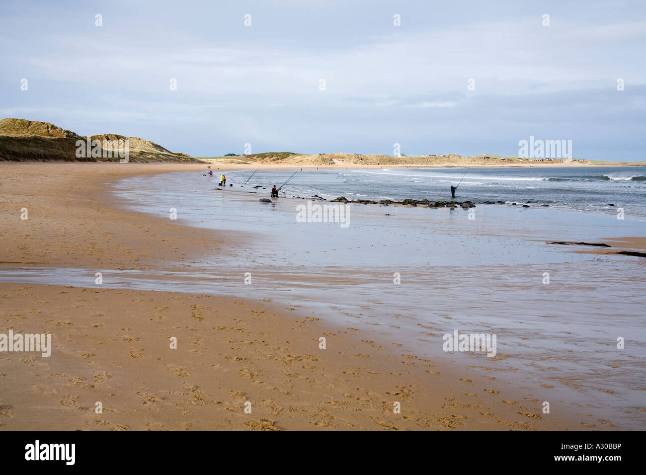 Dunstanburgh castle beach Northumberland England Stock Photo - Alamy